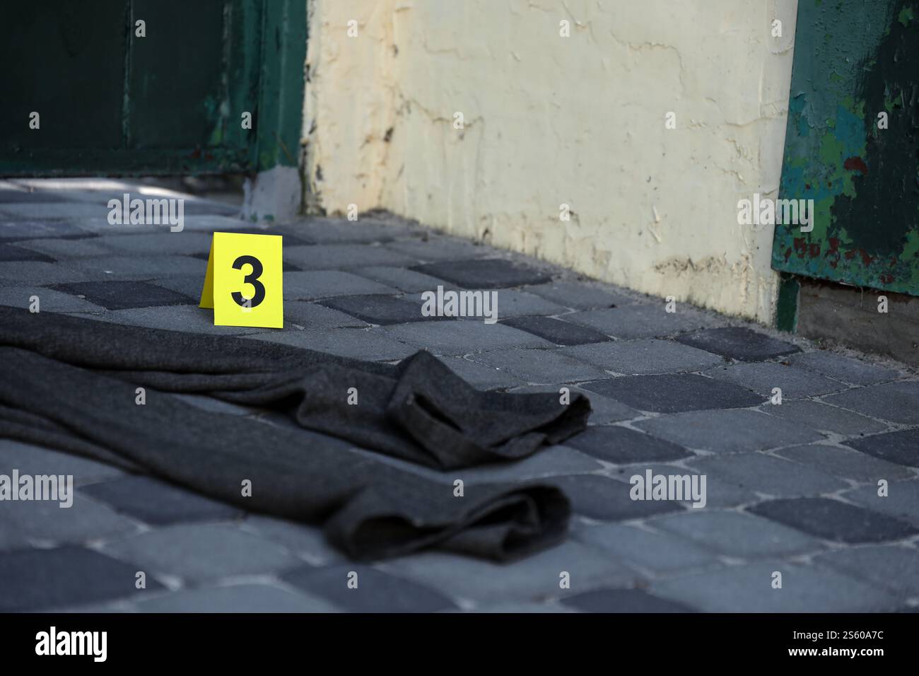 Evidence with yellow CSI marker for evidence numbering on the ...