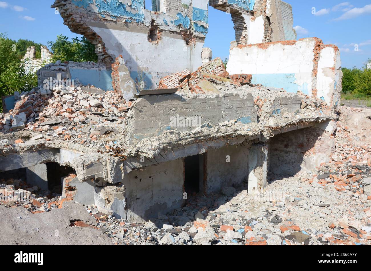 Collapsed industrial multistorey building in daytime. Disaster scene ...