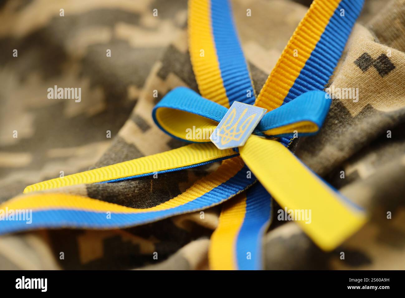 Pixeled digital military camouflage fabric with ukrainian flag and coat ...