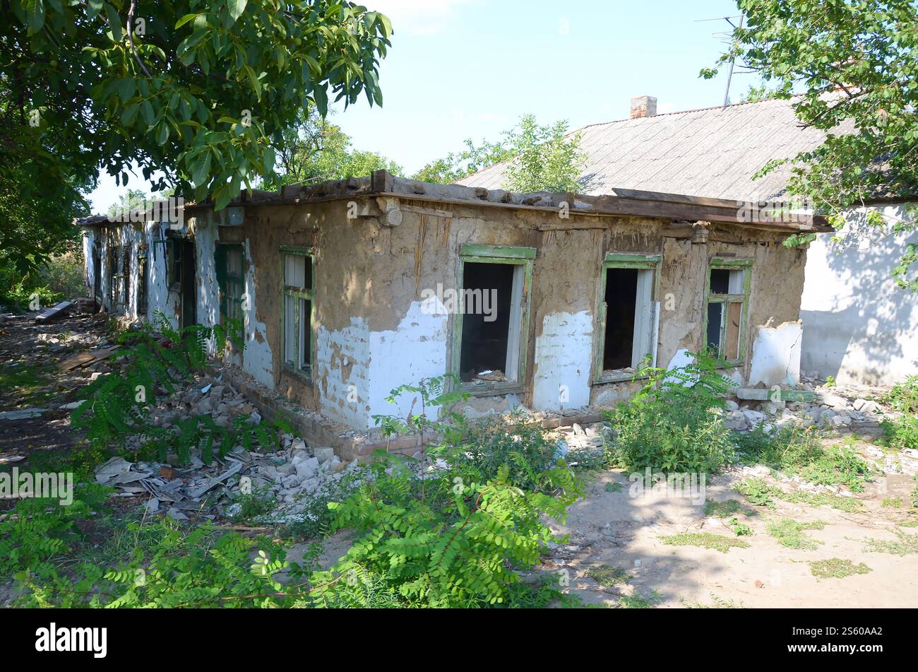 Collapsed industrial building in daytime. Disaster scene full of debris ...