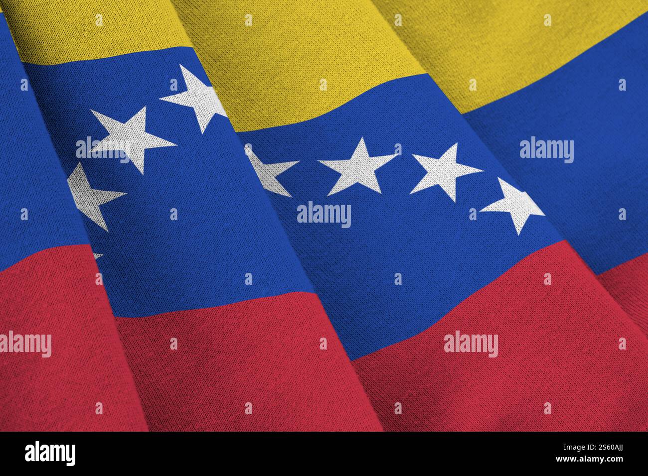 Venezuela flag with big folds waving close up under the studio light ...