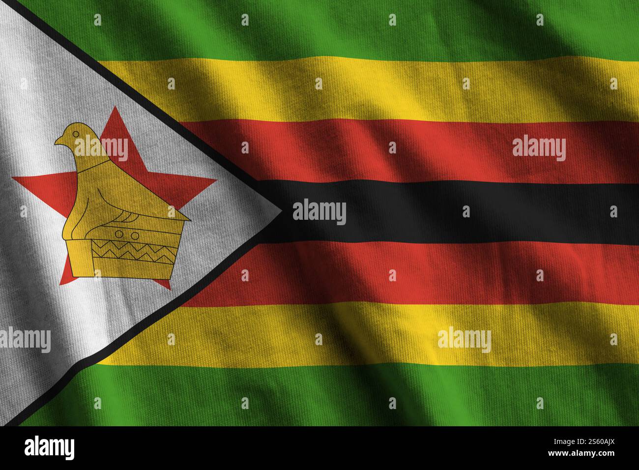 Zimbabwe flag with big folds waving close up under the studio light ...