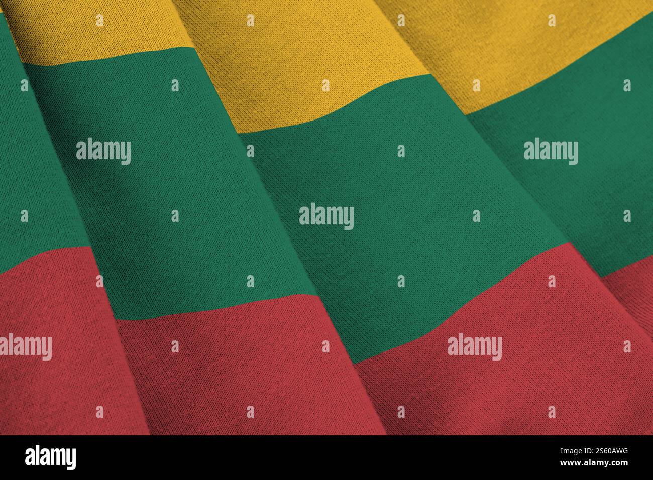 Lithuania flag with big folds waving close up under the studio light ...