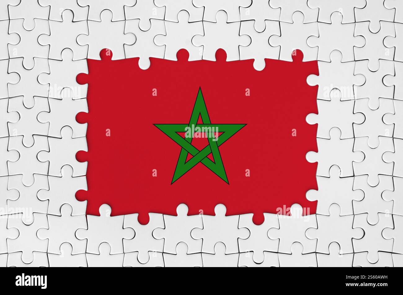 Morocco flag in frame of white puzzle pieces with missing central parts ...