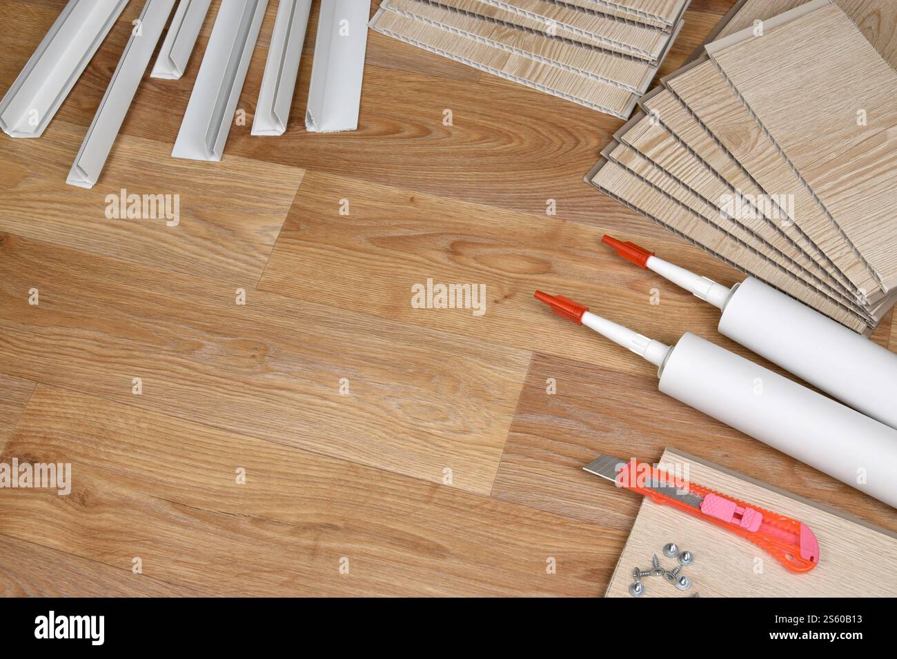 Set of items for PVC ceiling indoor works. Assembly adhesive bottles ...
