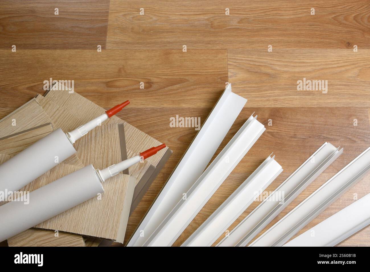 Set of items for PVC ceiling indoor works. Assembly adhesive bottles ...