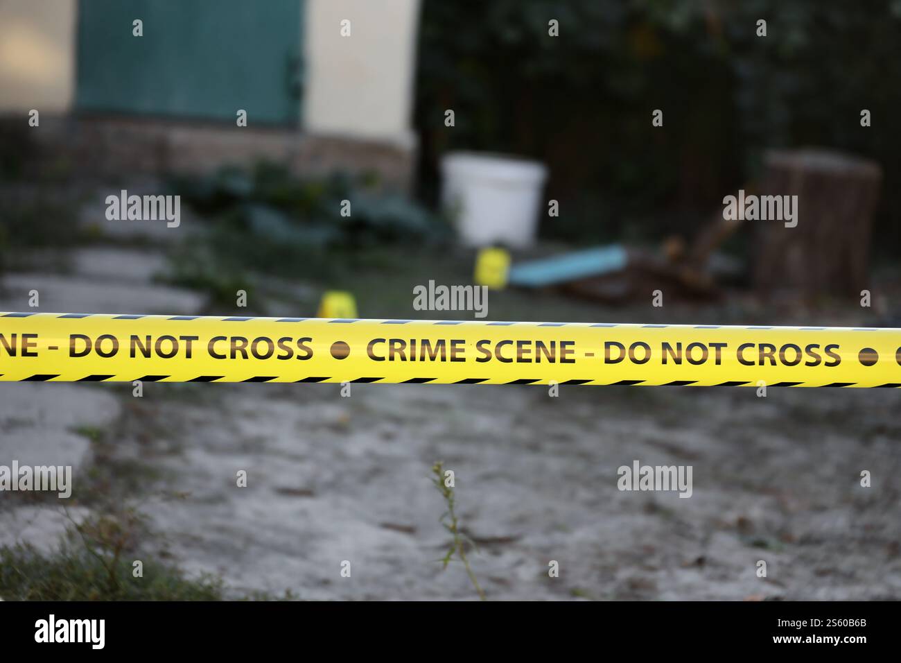 Crime scene tape for covering the area cordon. Yellow tape with blurred ...