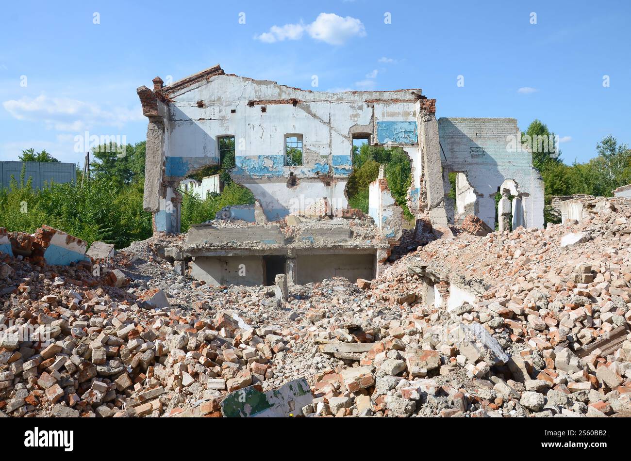 Collapsed industrial multistorey building in daytime. Disaster scene ...