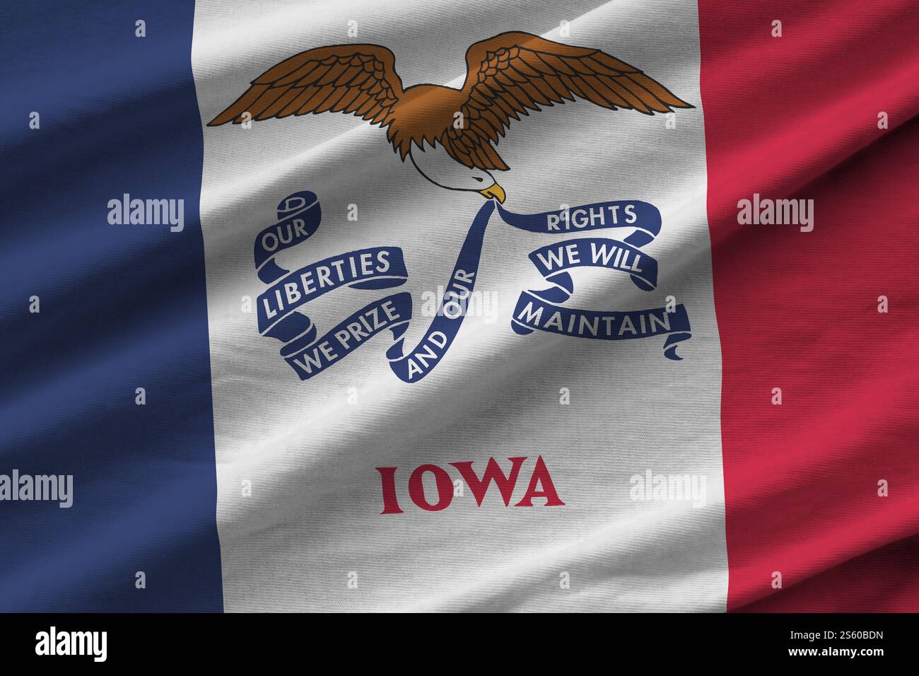 Iowa US state flag with big folds waving close up under the studio ...