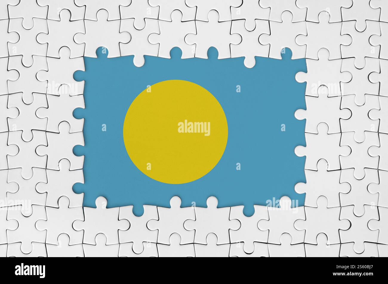Palau flag in frame of white puzzle pieces with missing central parts ...