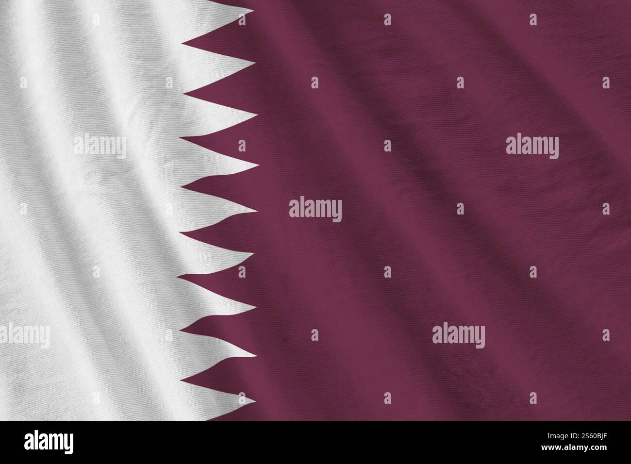 Qatar flag with big folds waving close up under the studio light ...