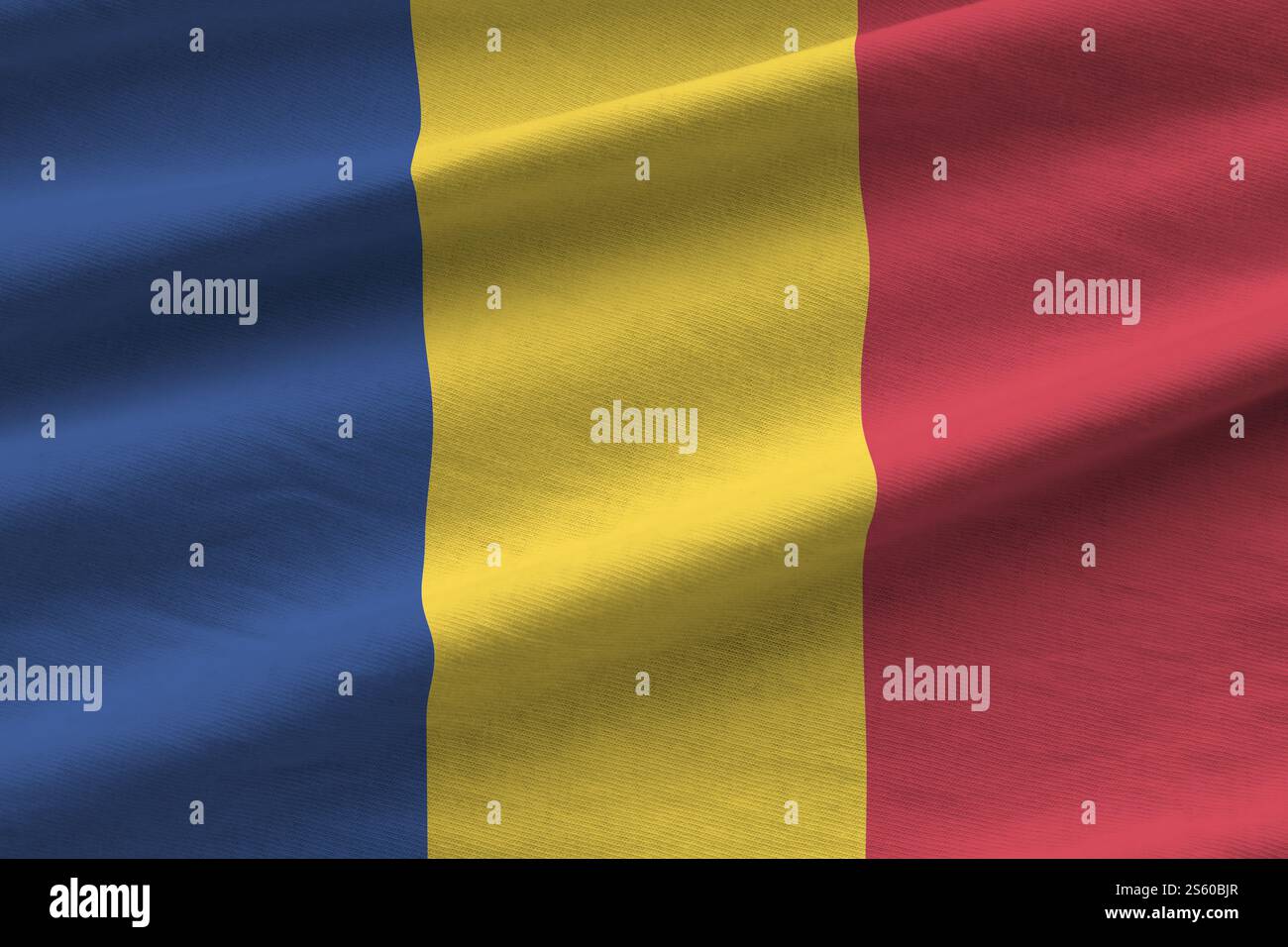 Romania flag with big folds waving close up under the studio light ...