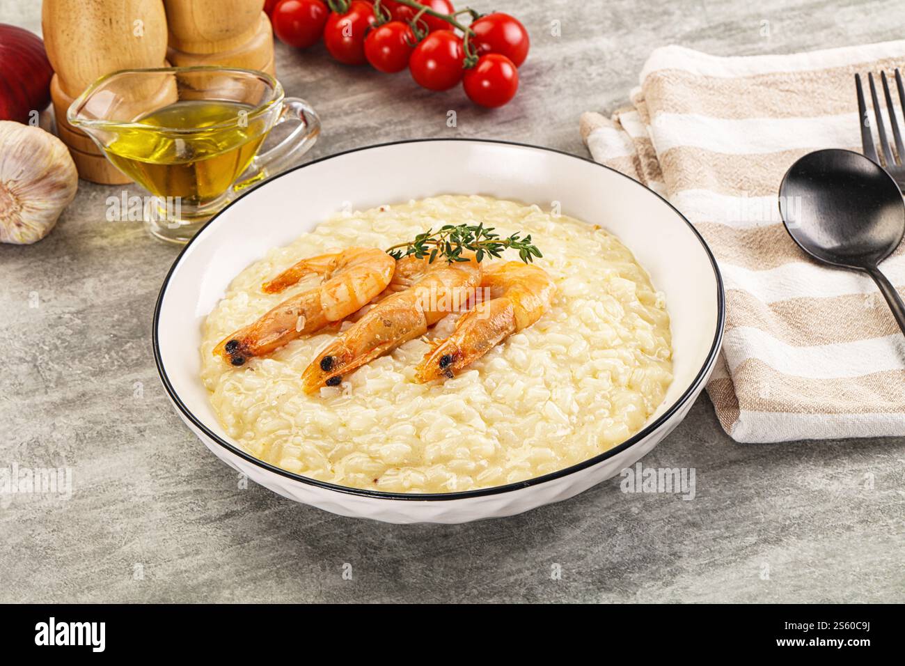 Italian cuisine - risotto with prawn served thyme Stock Photo - Alamy