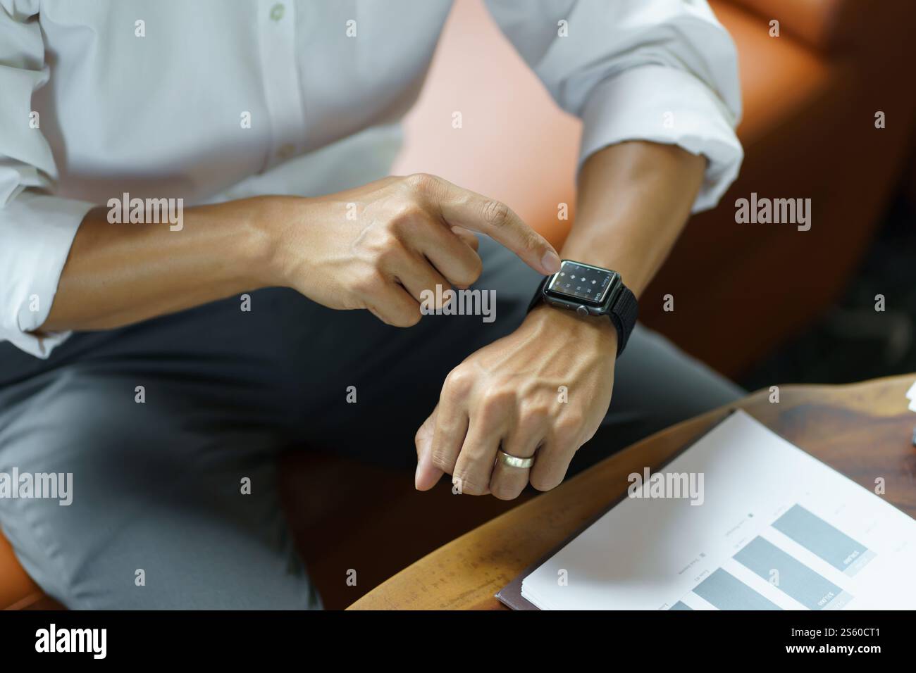 Business man Looking at smart watch In Office online connect Gadget ...