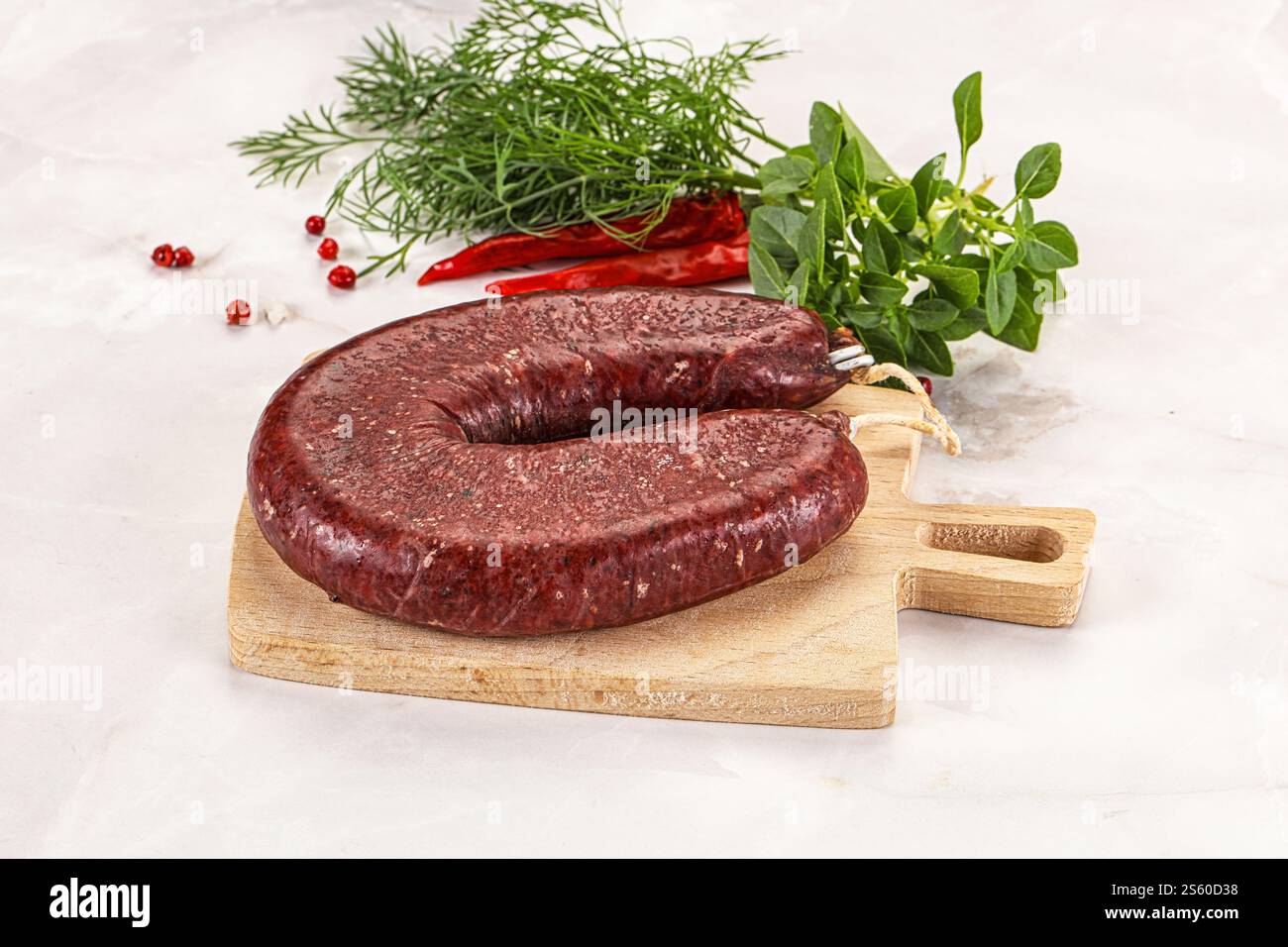 Delicious dry cured beef basturma with herbs and spices on table ...