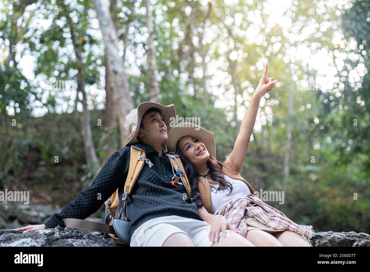 LGBT couple relaxing and taking selfies during their hiking adventure ...