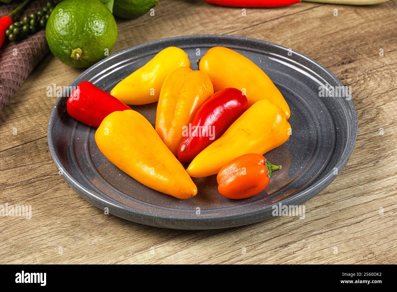 Small baby red and yellow bell pepper heap Stock Photo - Alamy