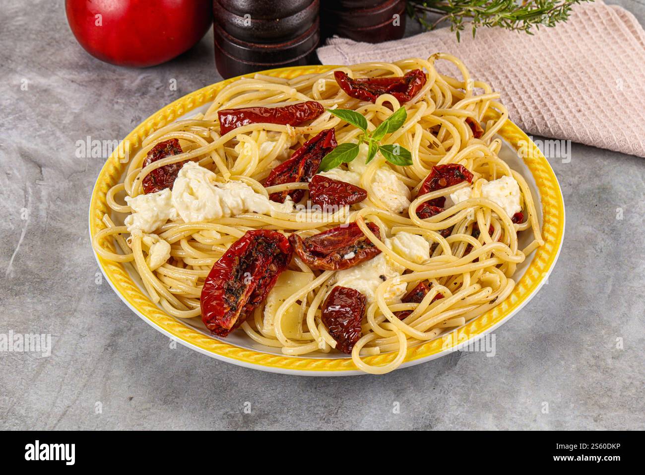 Italian pasta spaghetti with stracciatella and tomato Stock Photo - Alamy