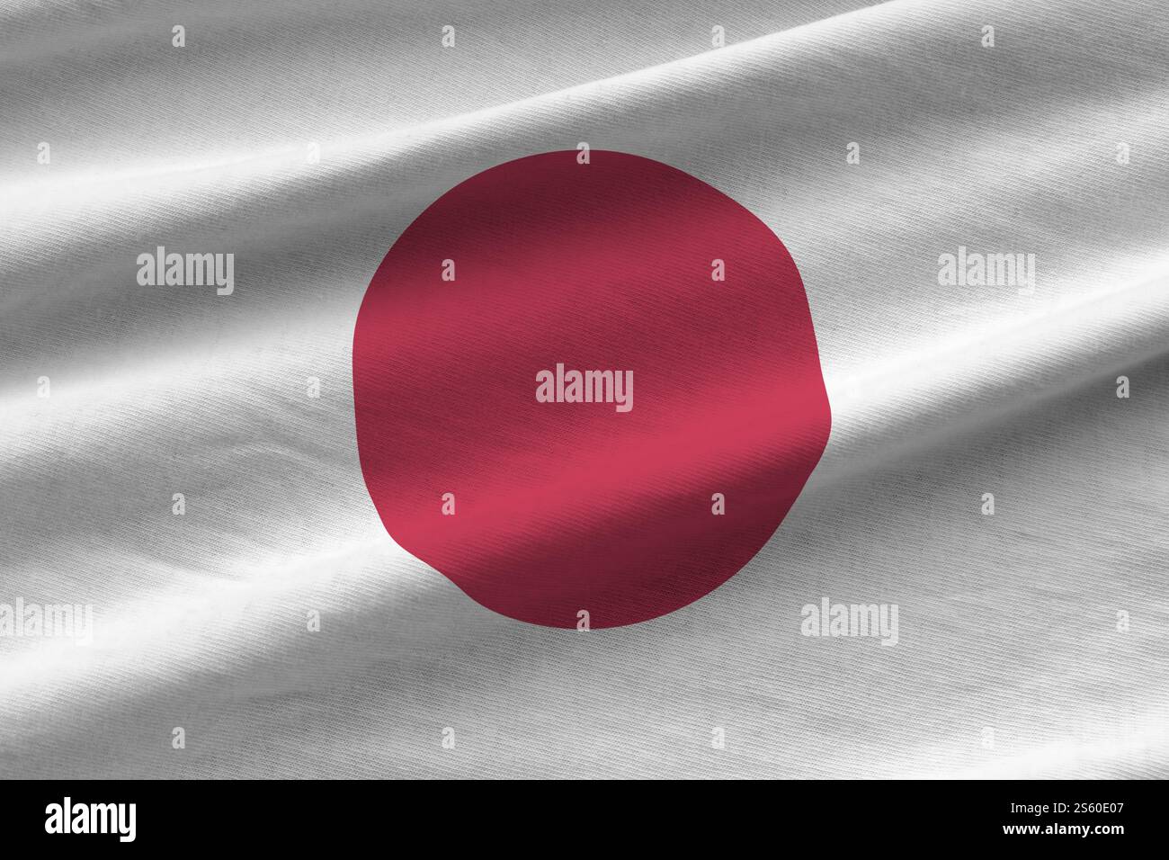 Japan flag with big folds waving close up under the studio light ...