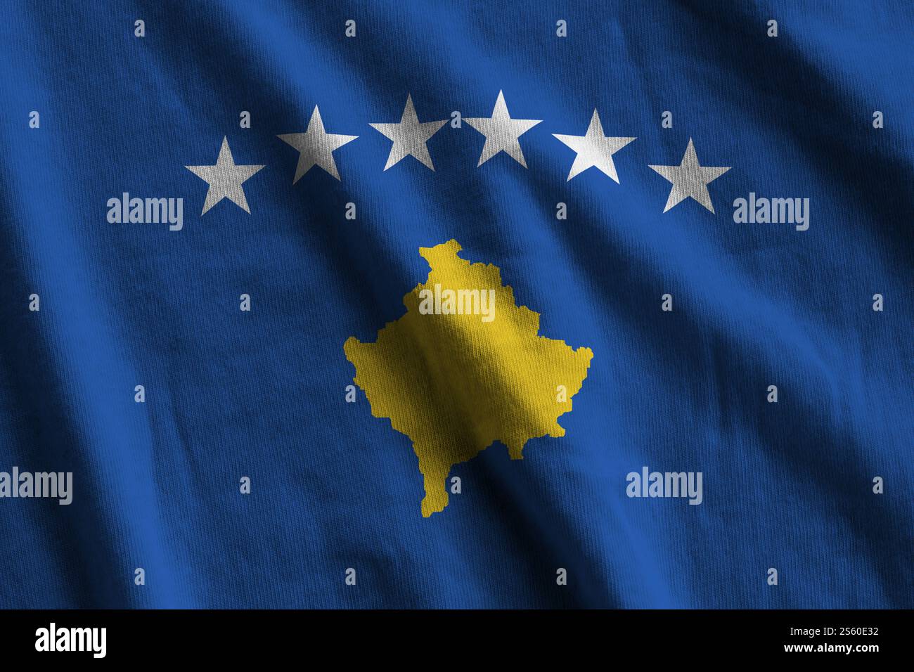 Kosovo flag with big folds waving close up under the studio light ...