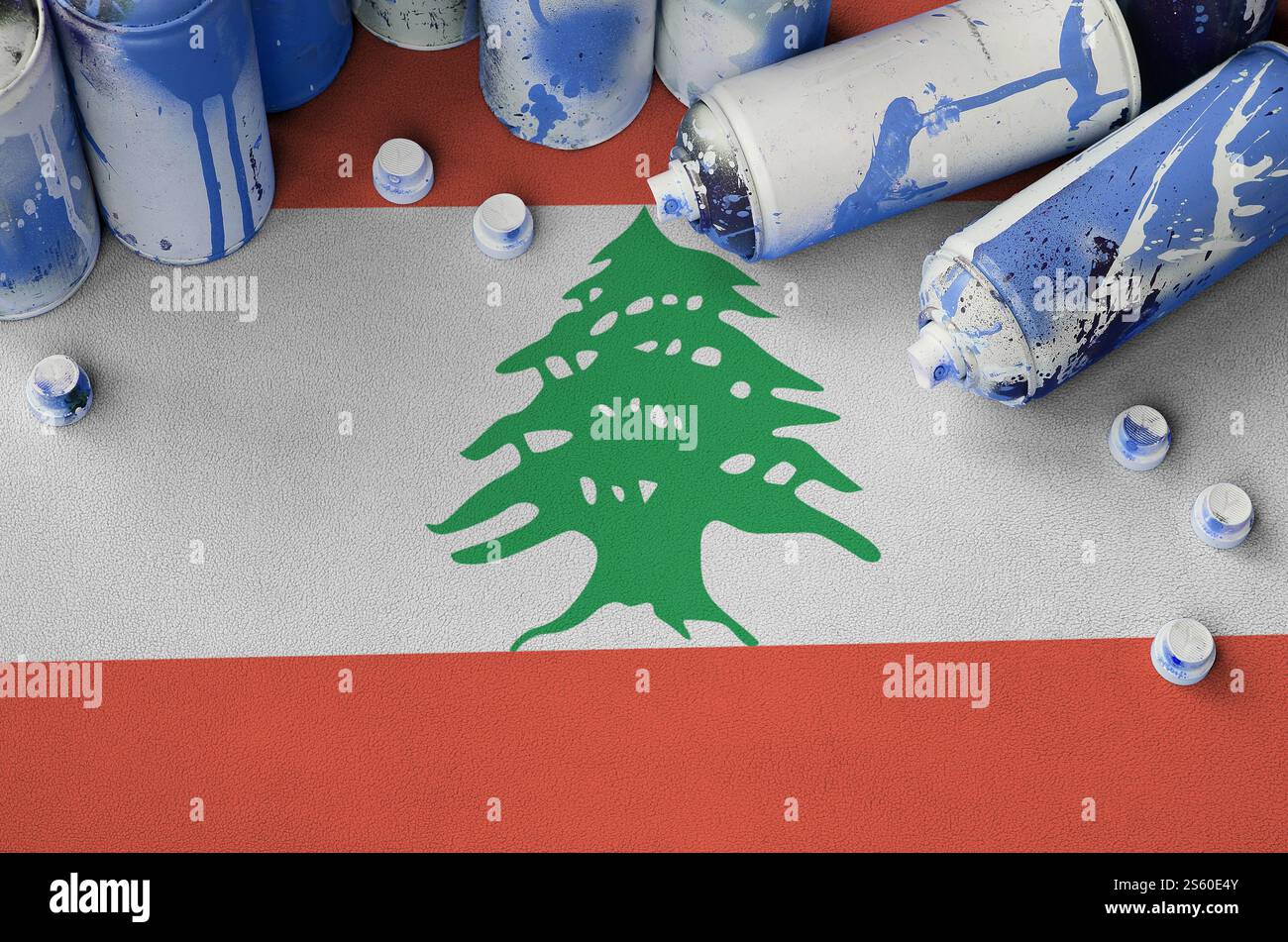 Lebanon flag and few used aerosol spray cans for graffiti painting ...