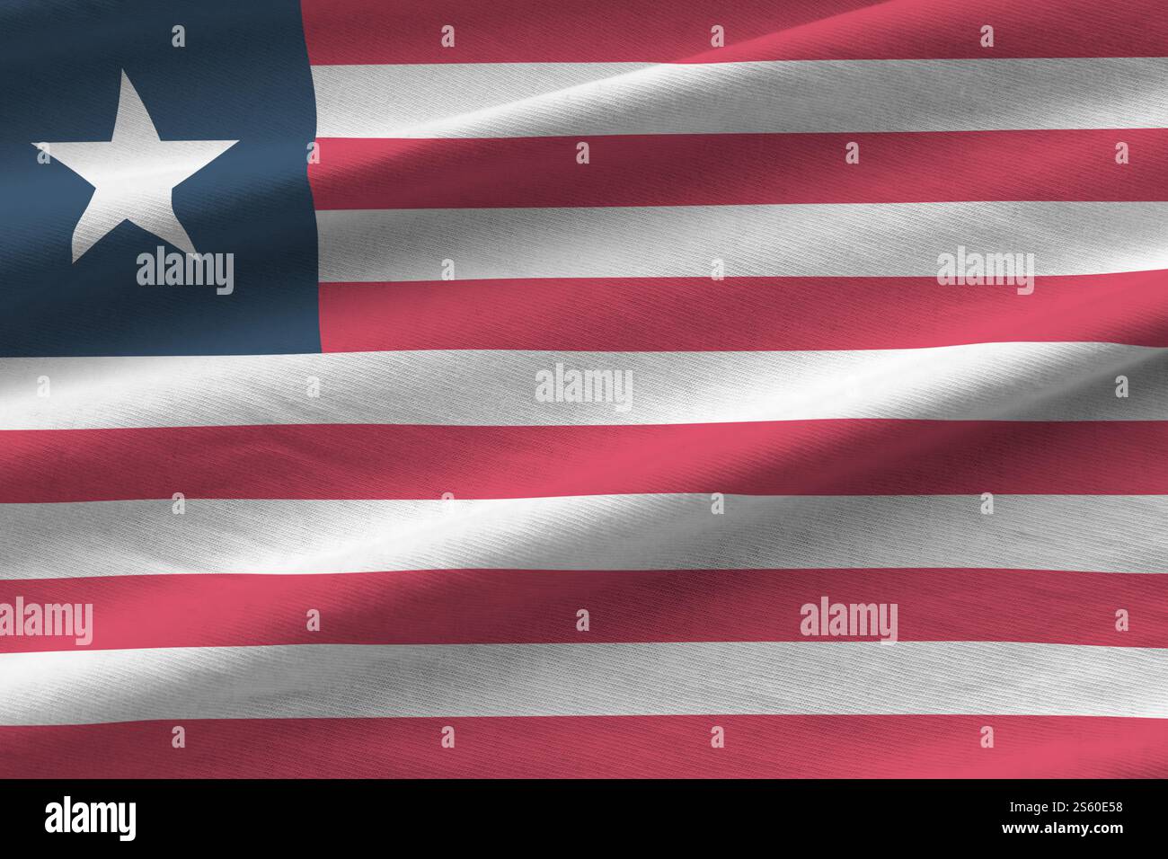 Liberia flag with big folds waving close up under the studio light ...