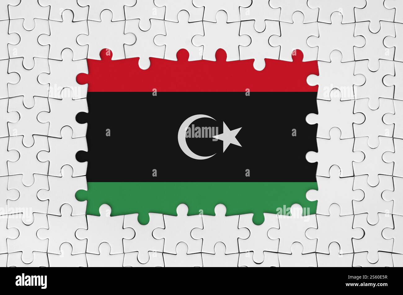 Libya flag in frame of white puzzle pieces with missing central parts ...