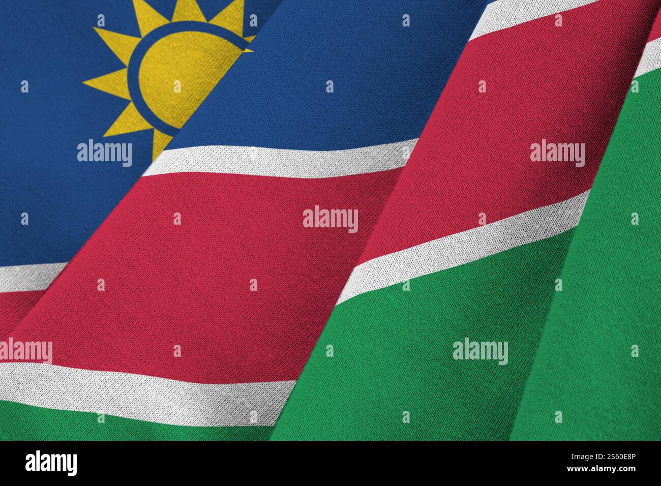 Namibia flag with big folds waving close up under the studio light ...