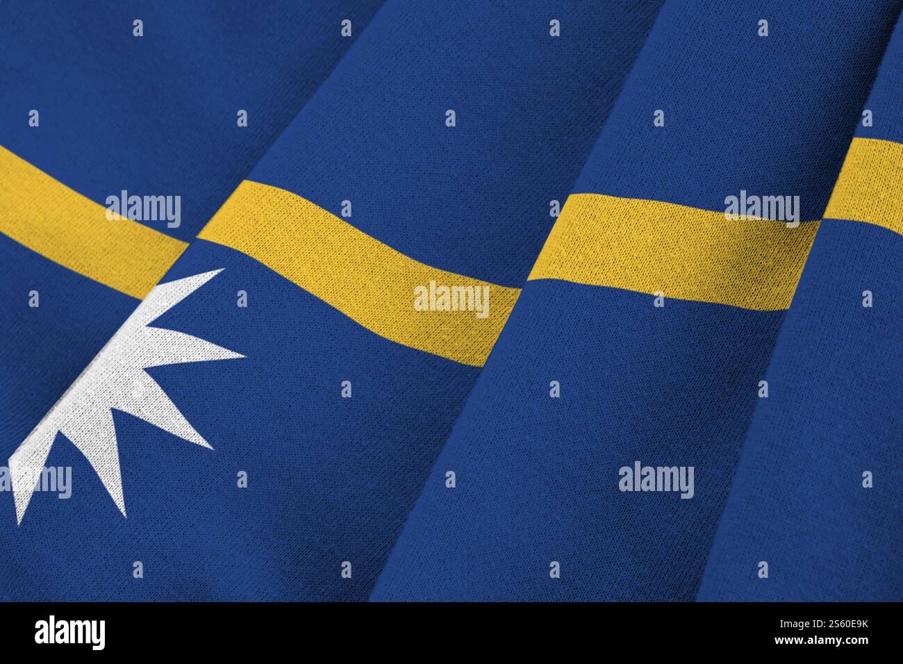 Nauru flag with big folds waving close up under the studio light ...