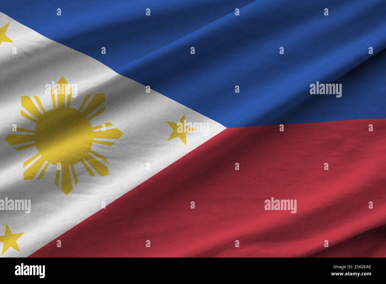 Philippines flag with big folds waving close up under the studio light ...