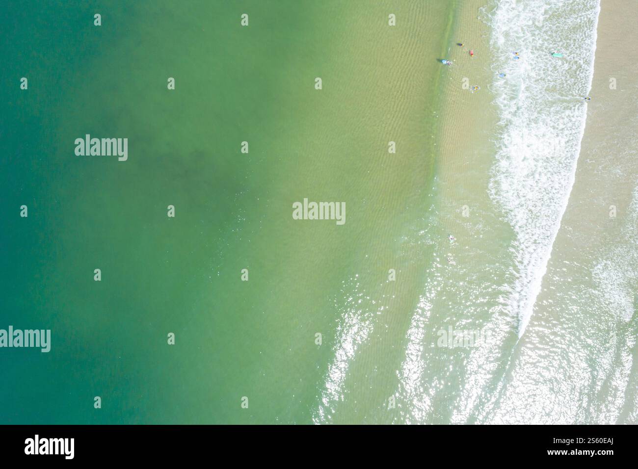turquoise seawater on the shore of a beach, aerial top view from a ...