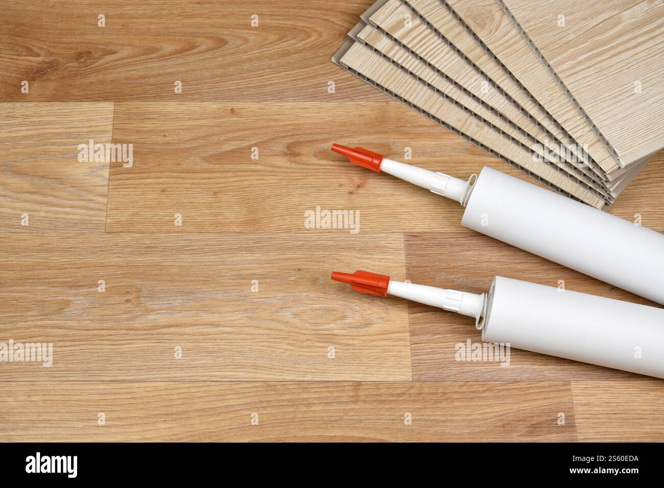 Set of items for PVC ceiling indoor works. Assembly adhesive bottles ...