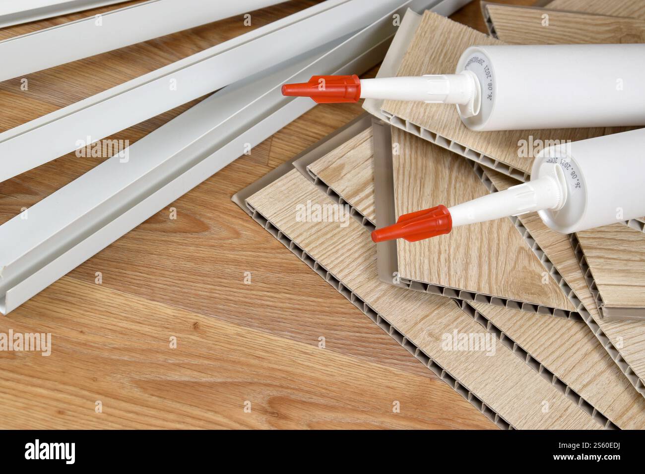Set of items for PVC ceiling indoor works. Assembly adhesive bottles ...