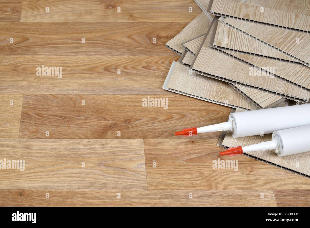 Set of items for PVC ceiling indoor works. Assembly adhesive bottles ...