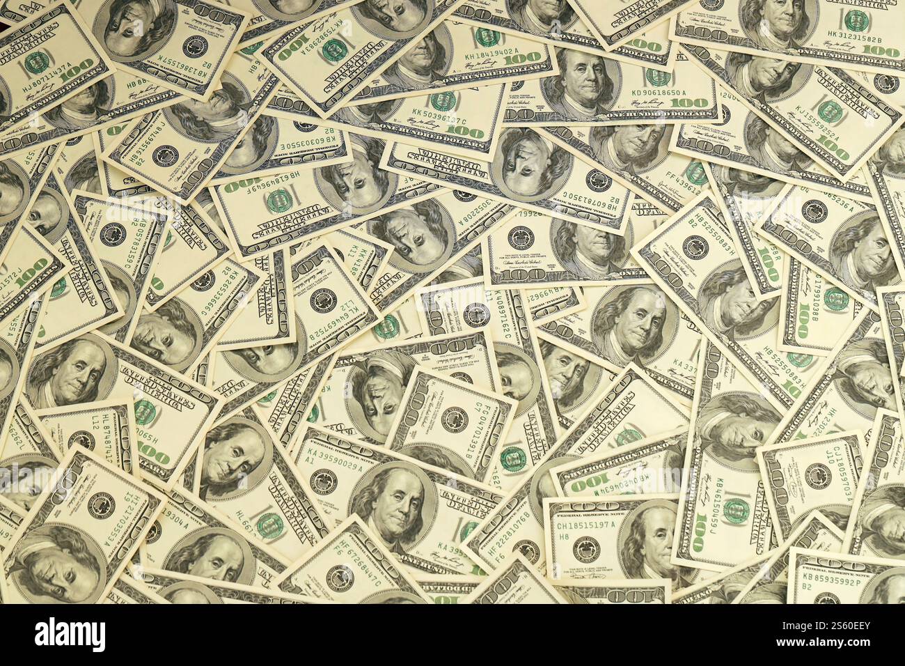 A pile of one hundred US banknotes with president portraits. Cash of ...