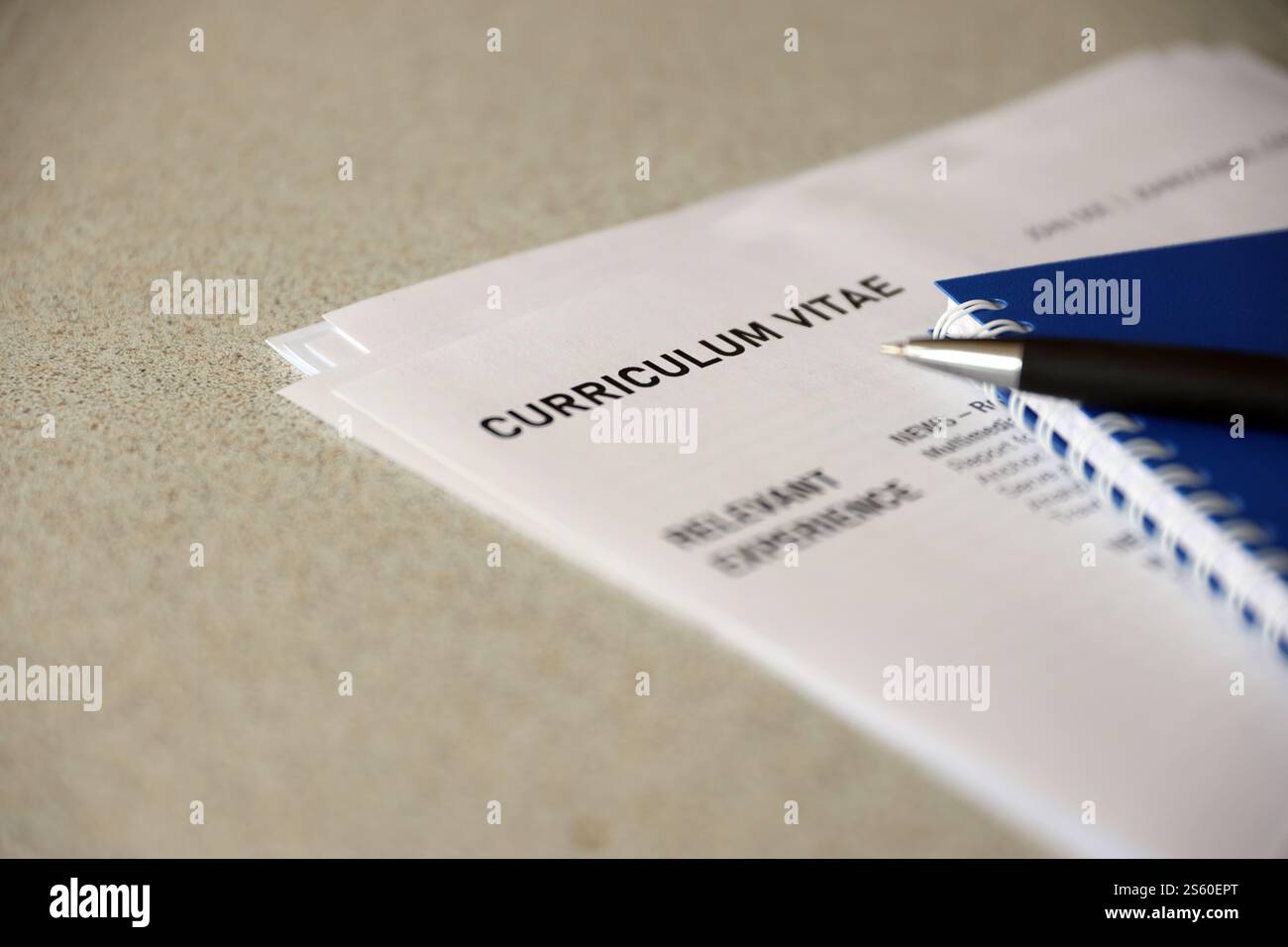 Top view of stack of office documents including resume and cv forms on ...