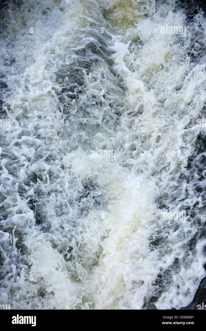 Waves of water of the river and the sea meet each other during high ...