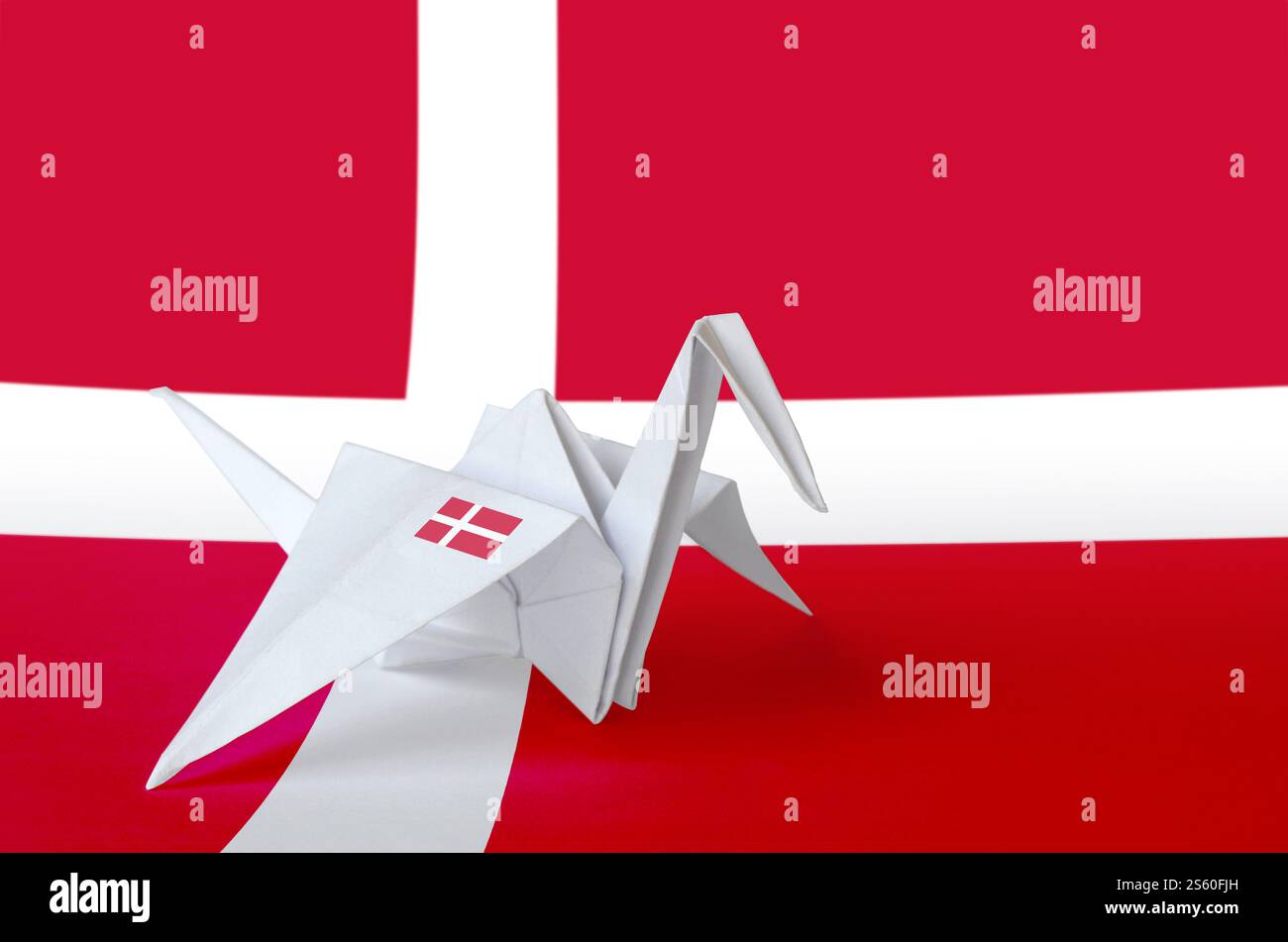 Denmark flag depicted on paper origami crane wing. Oriental handmade ...