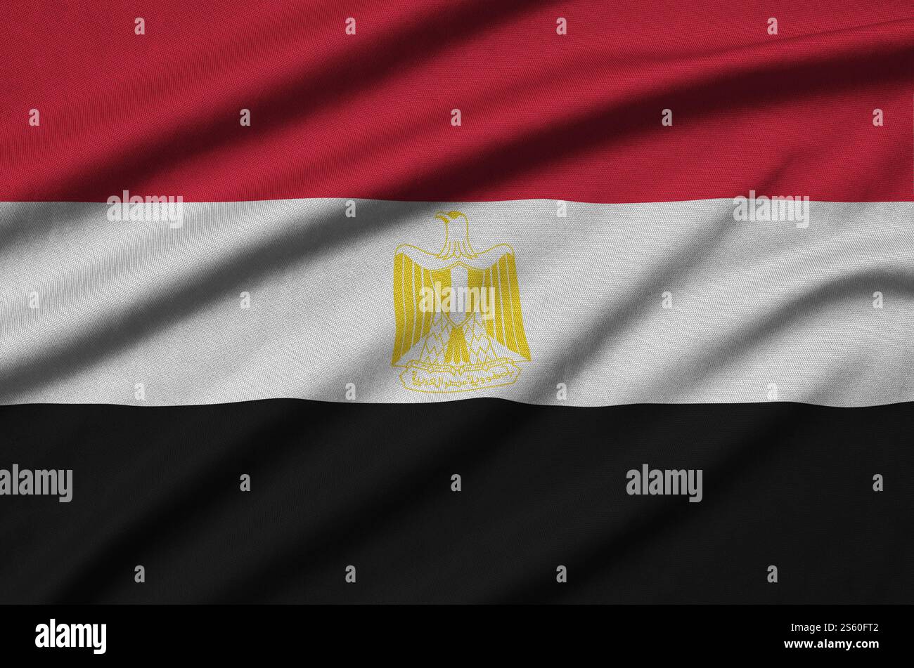 Egypt flag is depicted on a sports cloth fabric with many folds. Sport ...