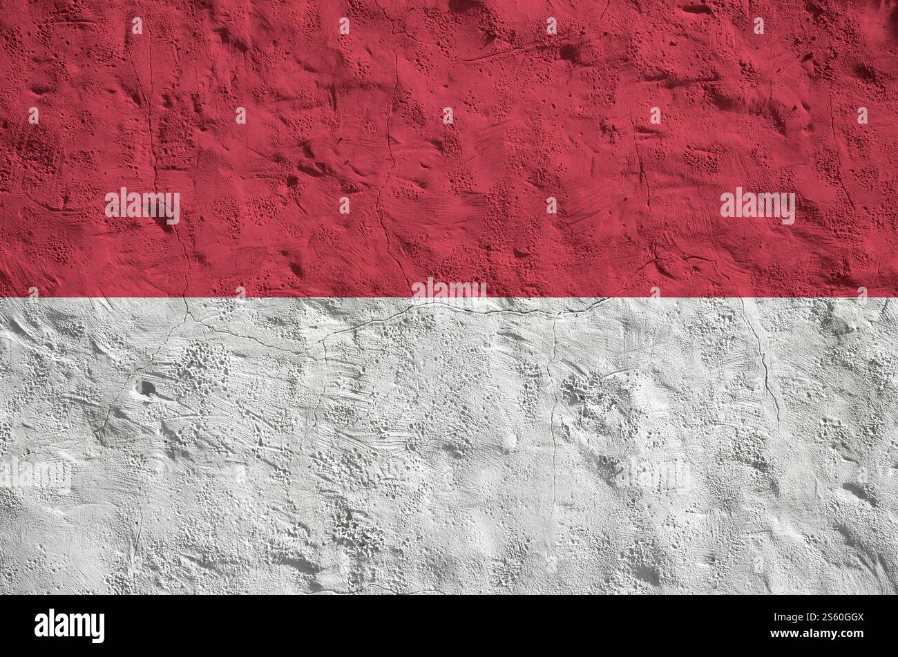 Monaco flag depicted in bright paint colors on old relief plastering ...