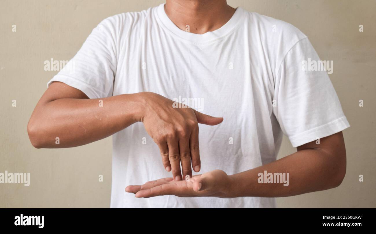 young man showing sign language with hand gestures speaking body ...