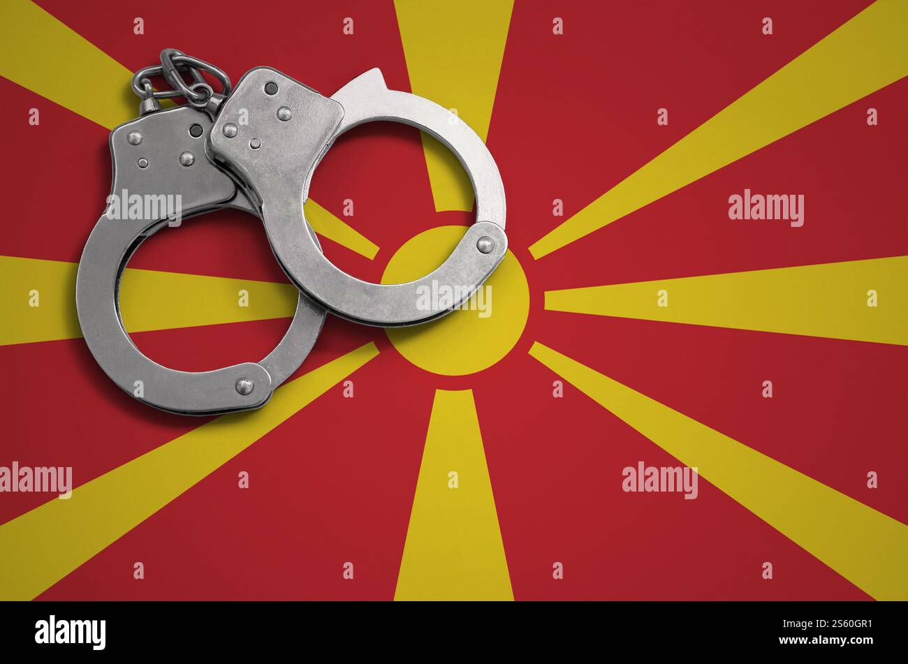 Macedonia flag and police handcuffs. The concept of crime and offenses ...
