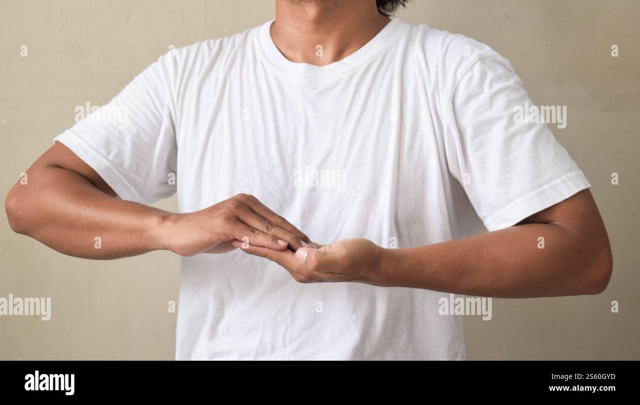 young man showing sign language with hand gestures speaking body ...