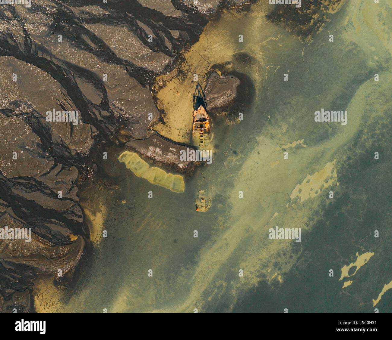 Aerial view of the Clyne Castle shipwreck resting in shallow waters ...