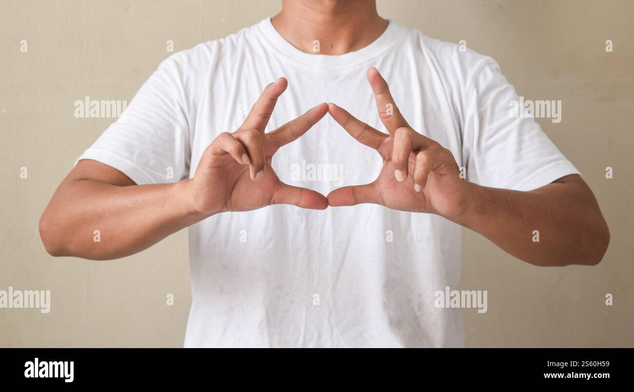 young man showing sign language with hand gestures speaking body ...