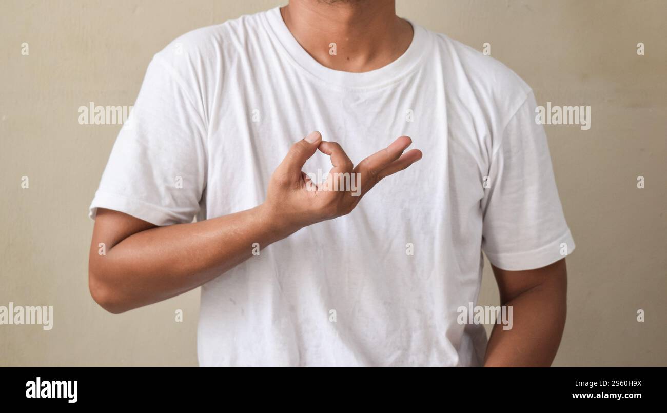 young man showing sign language with hand gestures speaking body ...