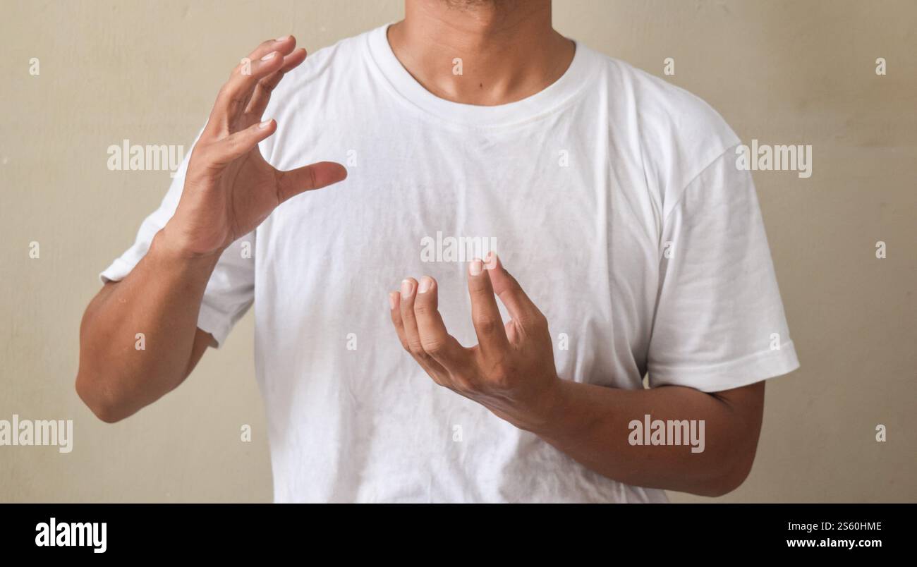 young man showing sign language with hand gestures speaking body ...