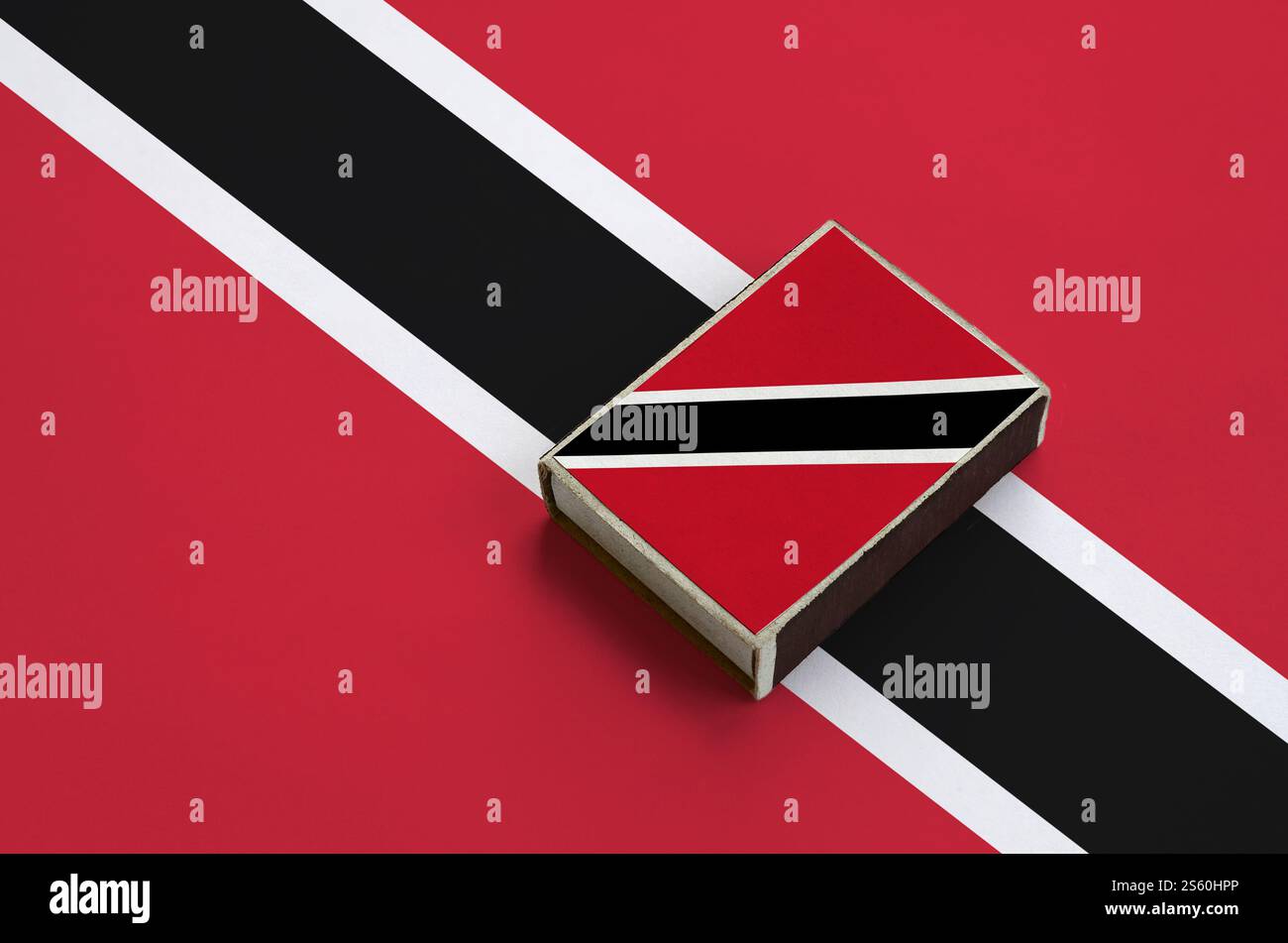 Trinidad and Tobago flag is pictured on a matchbox that lies on a large ...