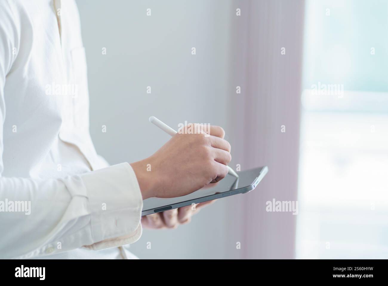 Businessman holding in hand tablet. hand pointing screen presented in ...