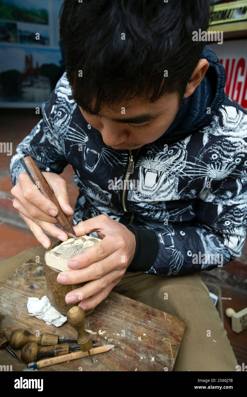 January 27, 2018 - Hanoi, Vietnam: Vietnamese man carving a wooden ...